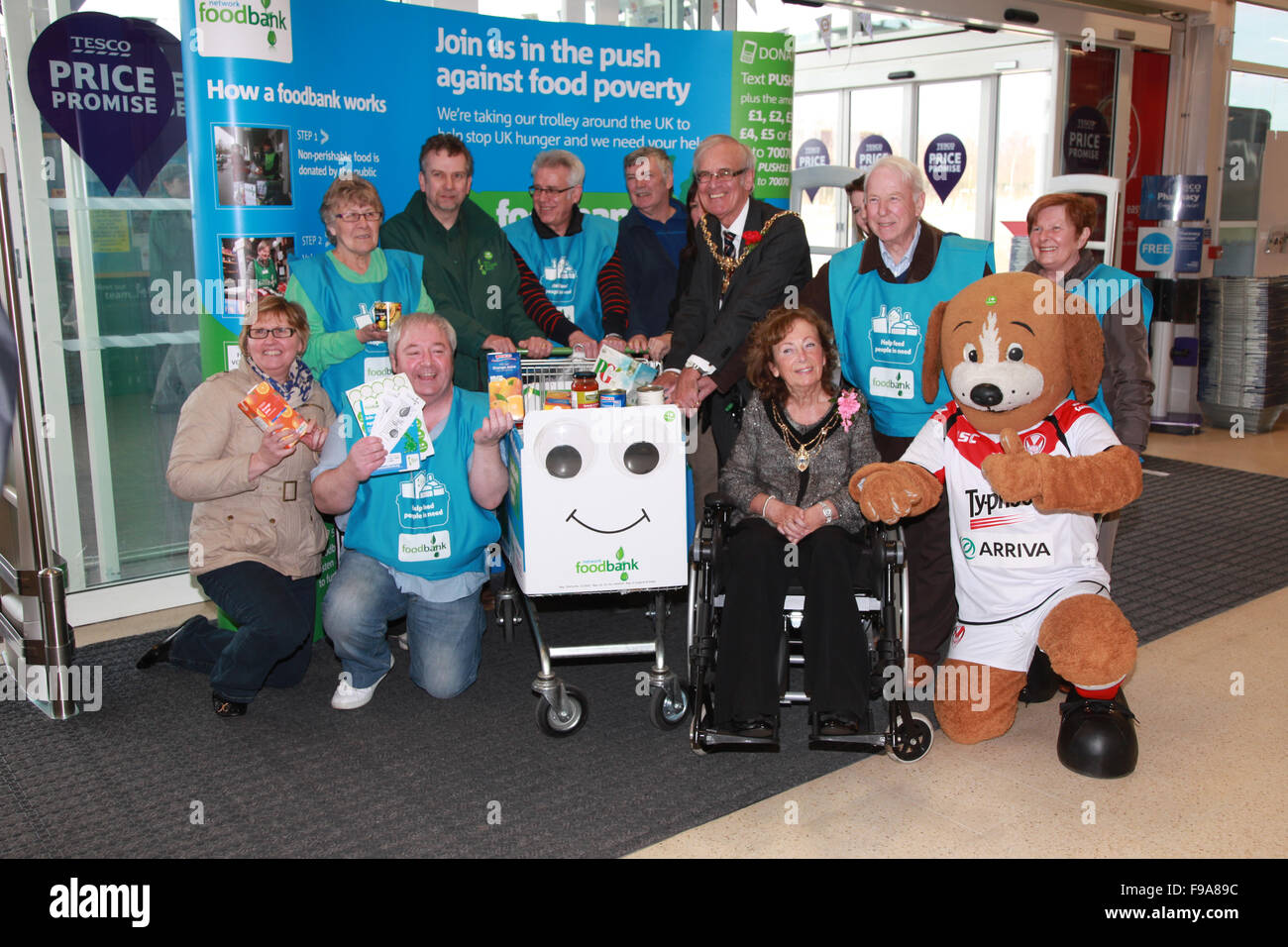 charity workers helping out with the foodbank at a local supermarket ...