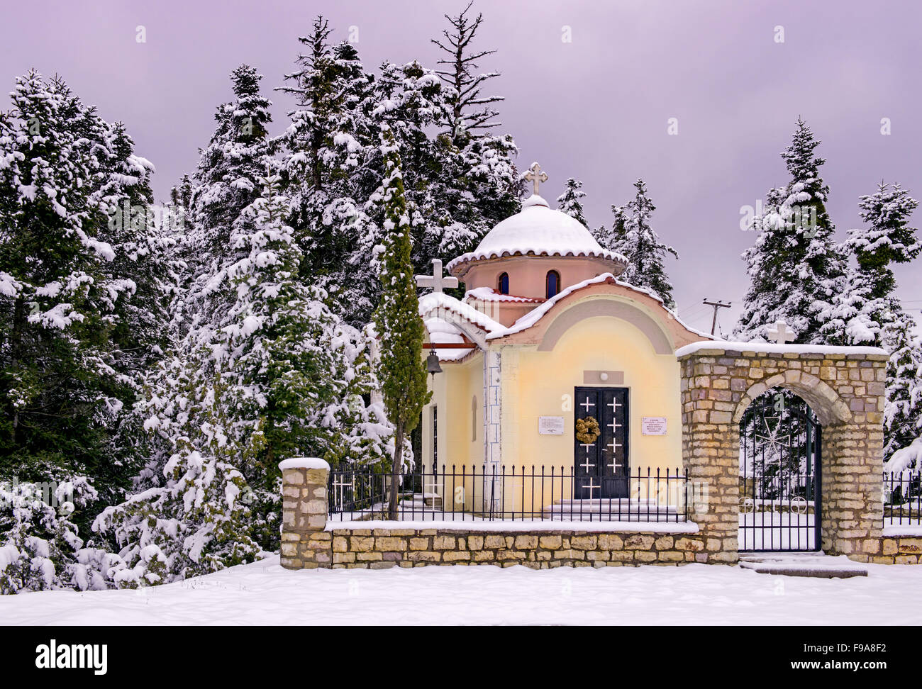 A snow covered church in Athanasios Diakos village situated in ...