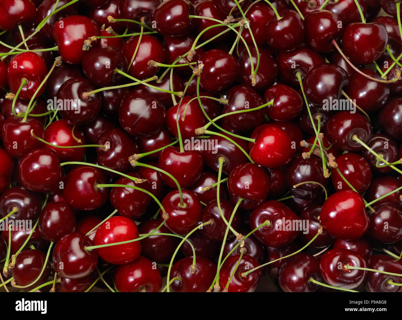 full frame background showing lots of red cherries Stock Photo - Alamy