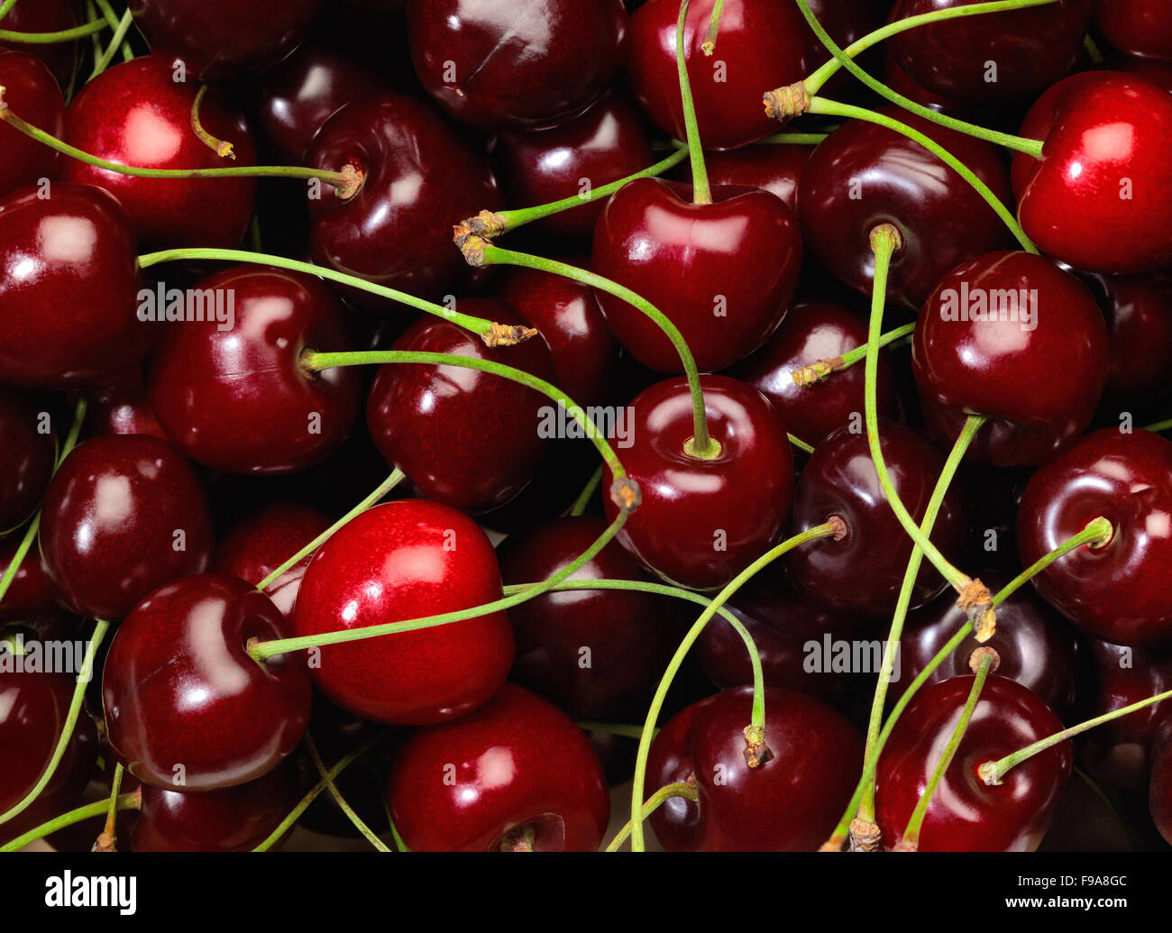 full frame background showing lots of red cherries Stock Photo - Alamy