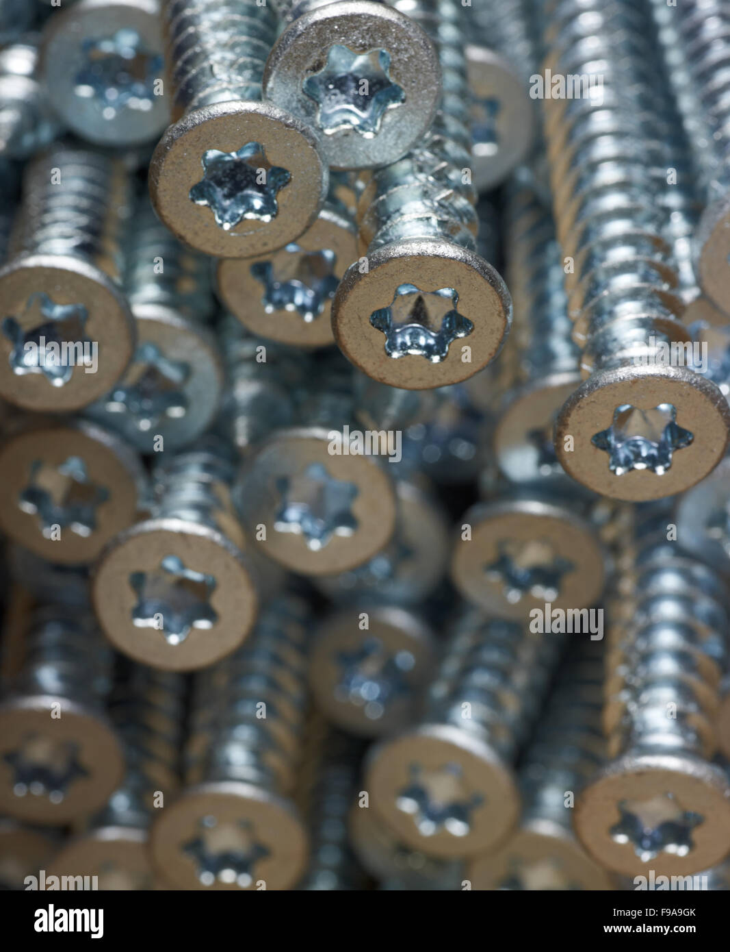 full frame background showing lots of long screws Stock Photo - Alamy