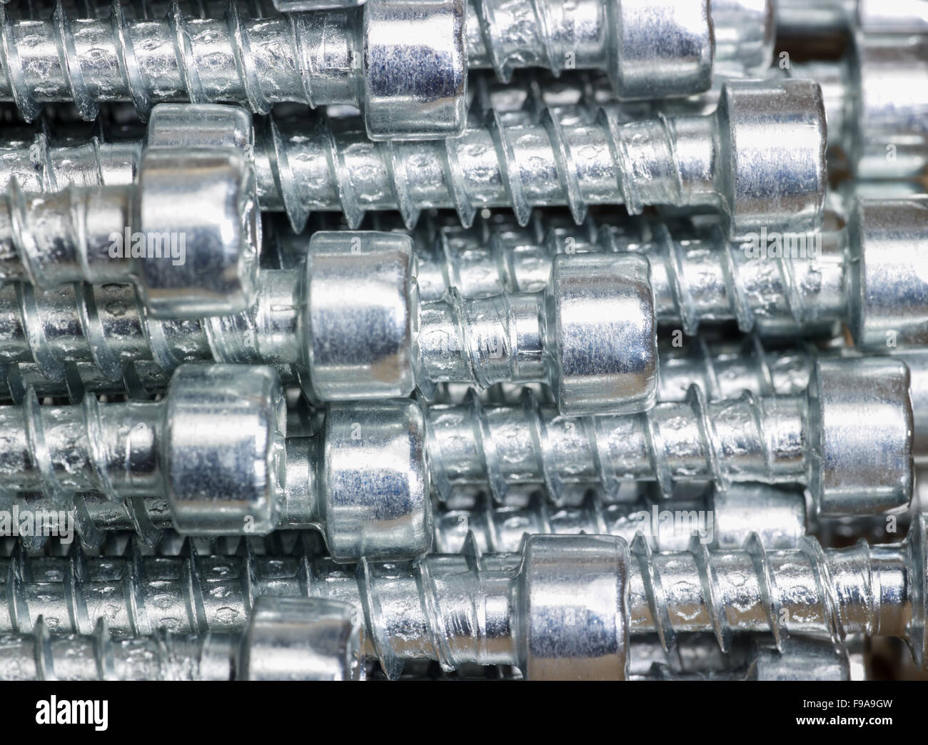 full frame background showing lots of screws Stock Photo - Alamy