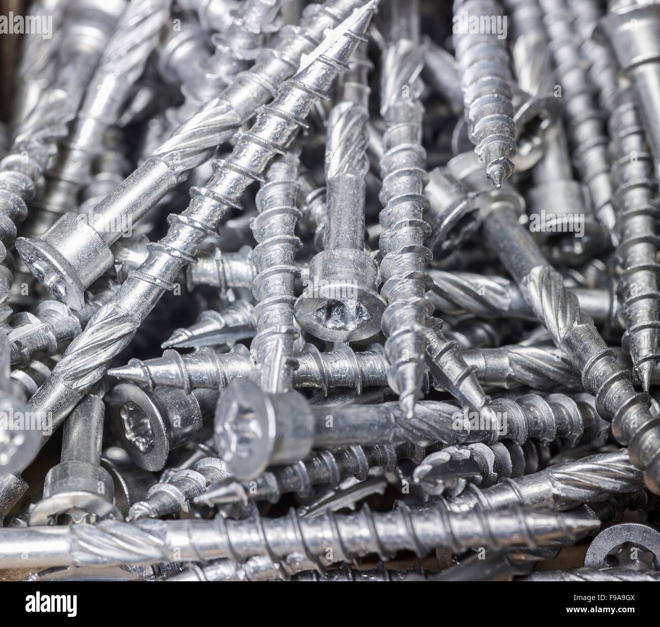 full frame background showing lots of screws Stock Photo - Alamy