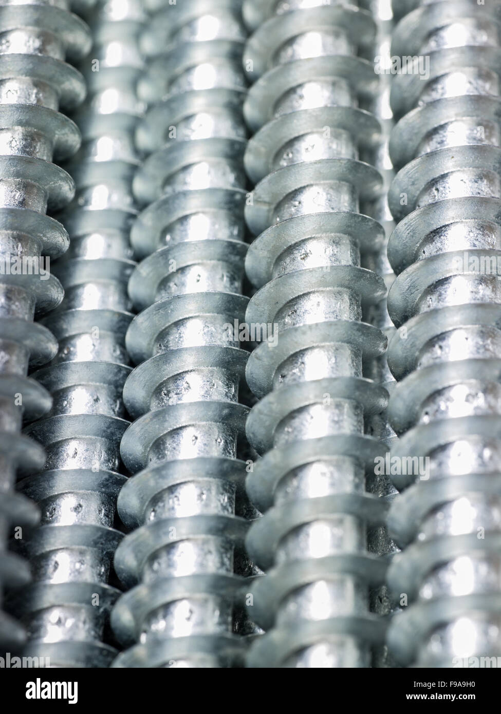 full frame background showing lots of long screws Stock Photo - Alamy