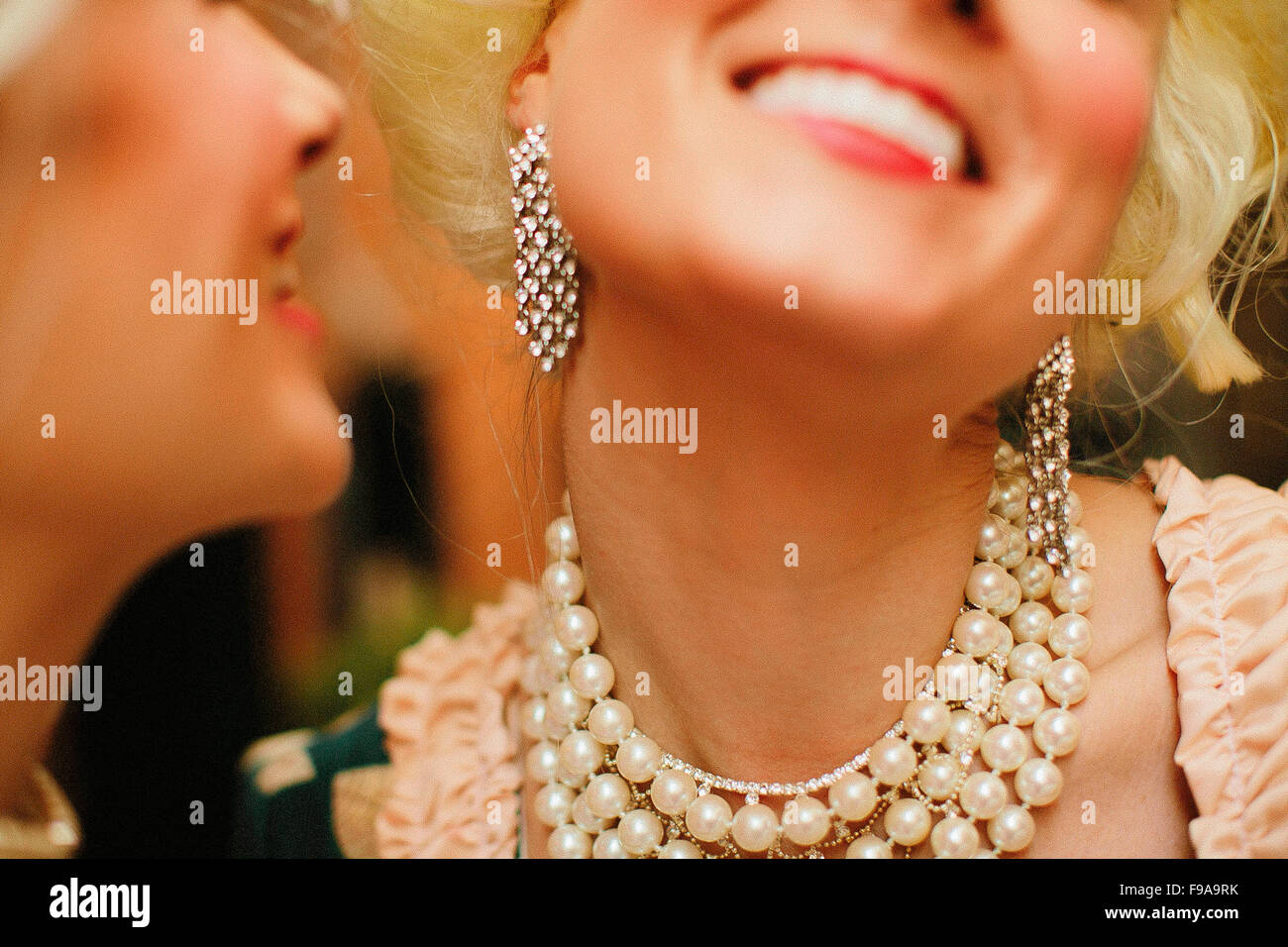 Women in Victorian themed dinner laughing Stock Photo - Alamy