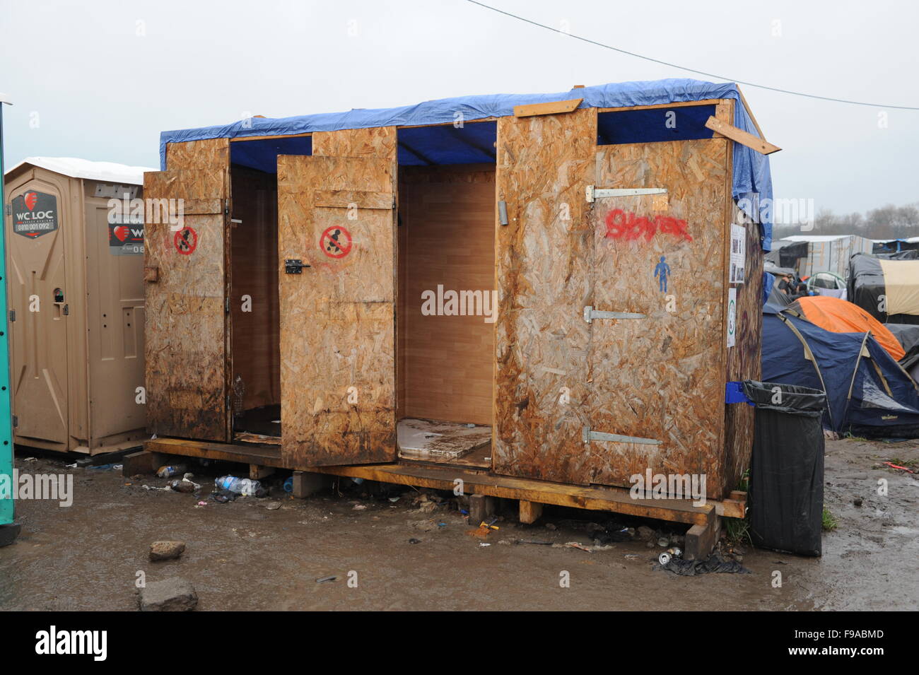 CALAIS, FRANCE. December 13th 2015. Three makeshift wooden shower ...