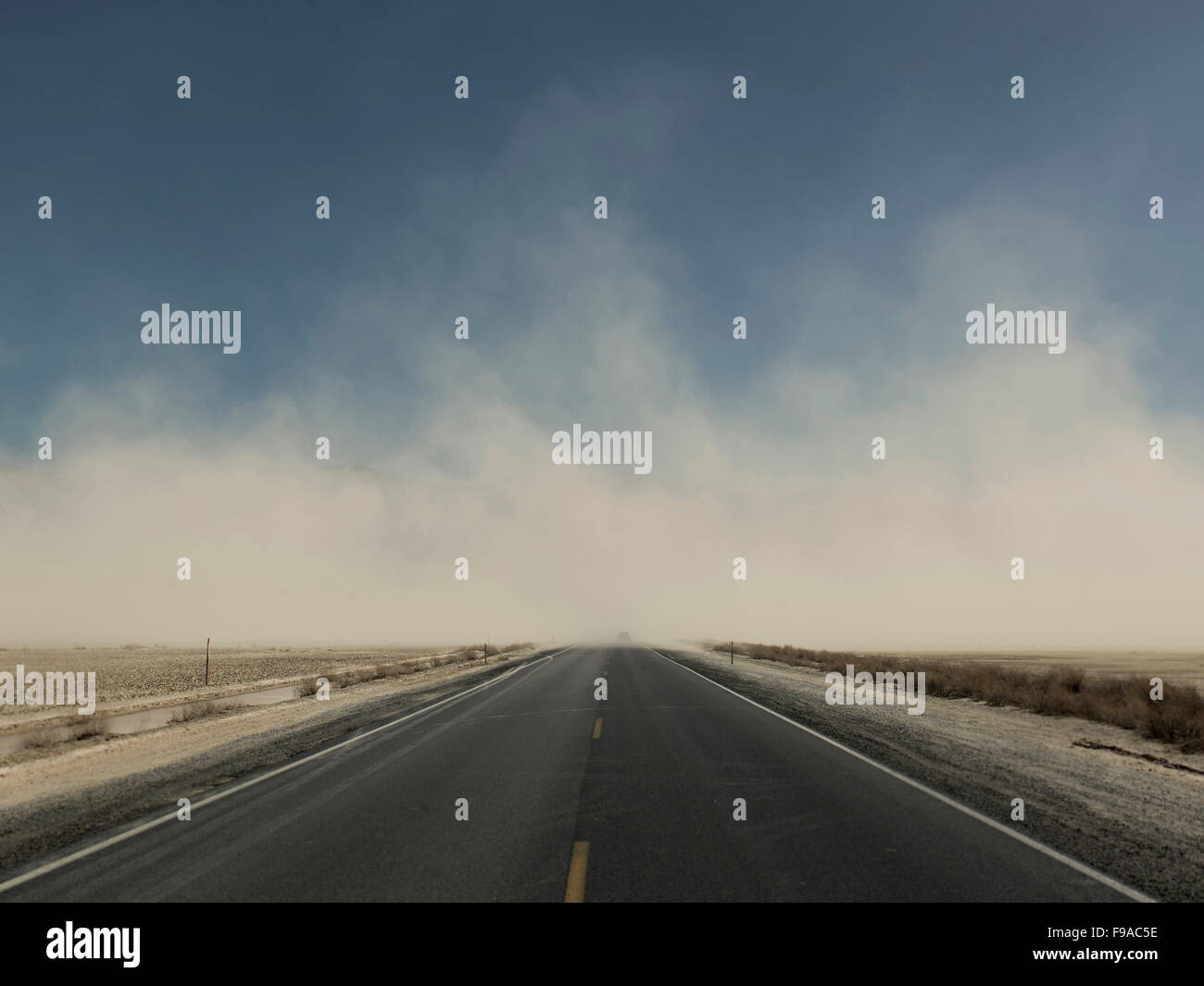A road is covered with wind blown dust in Death Valley, California ...