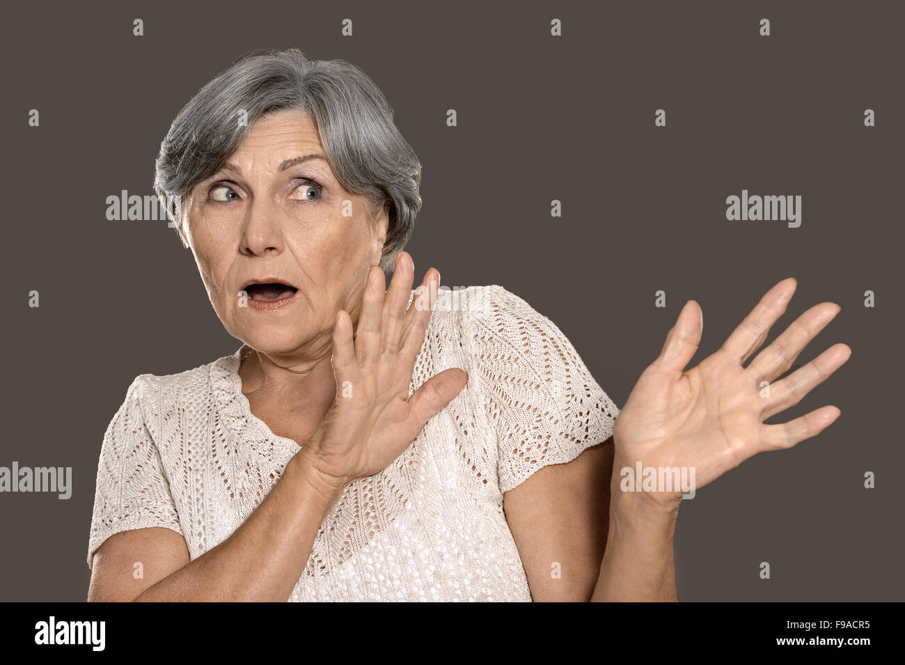 Scared elderly woman Stock Photo - Alamy