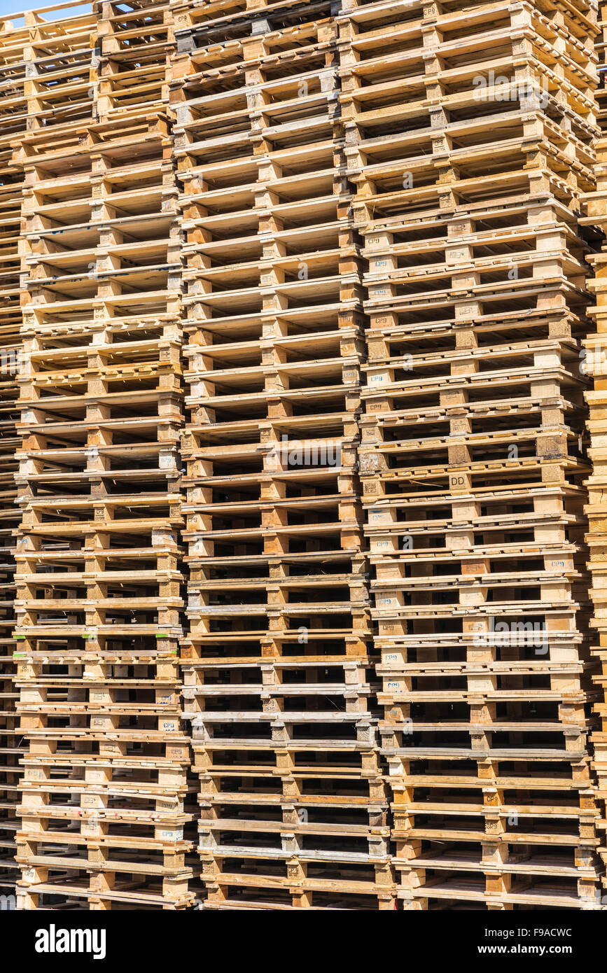 Wooden pallet overlap in warehouse Stock Photo - Alamy
