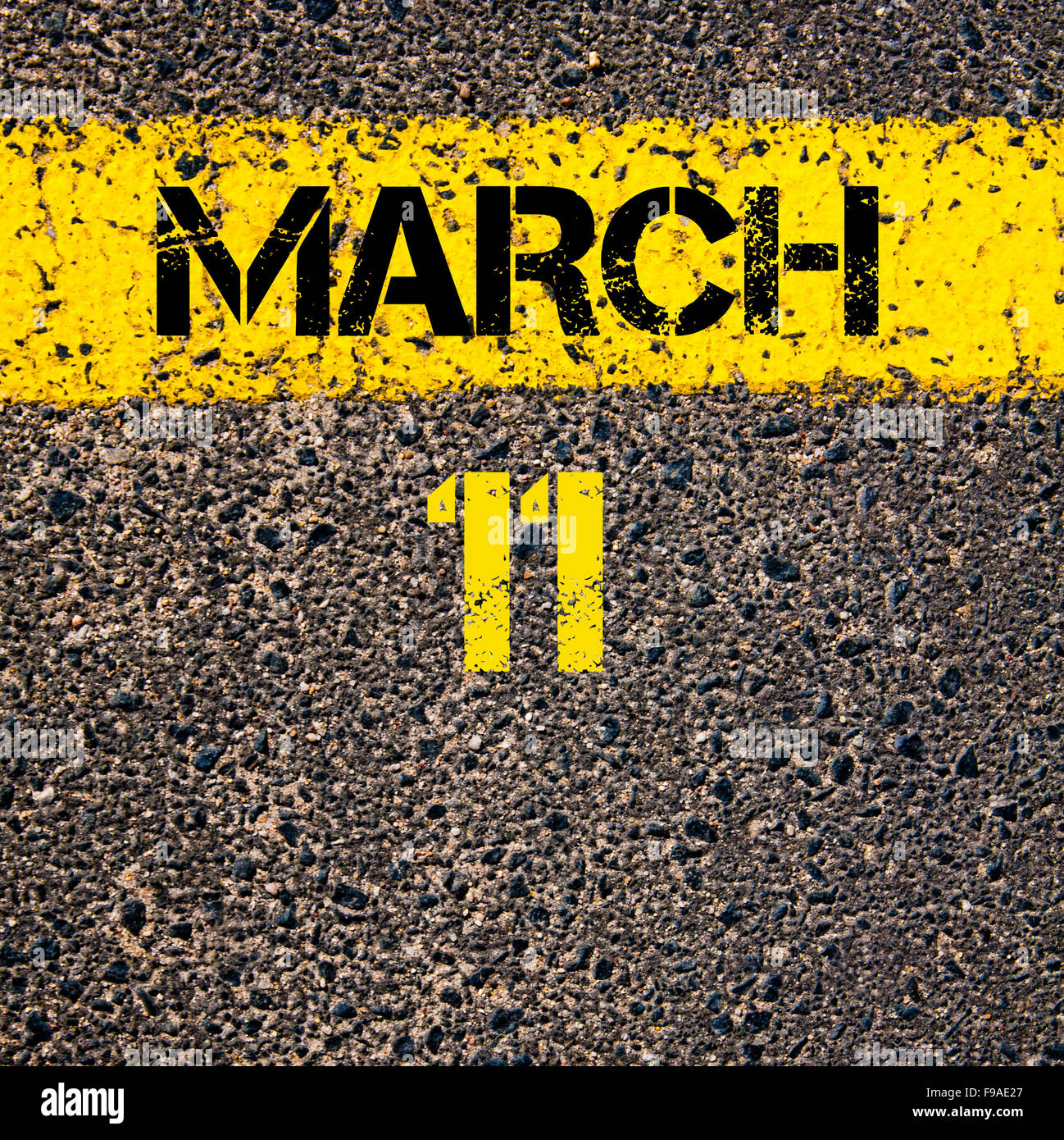 11 March calendar day written over road marking yellow paint line Stock ...
