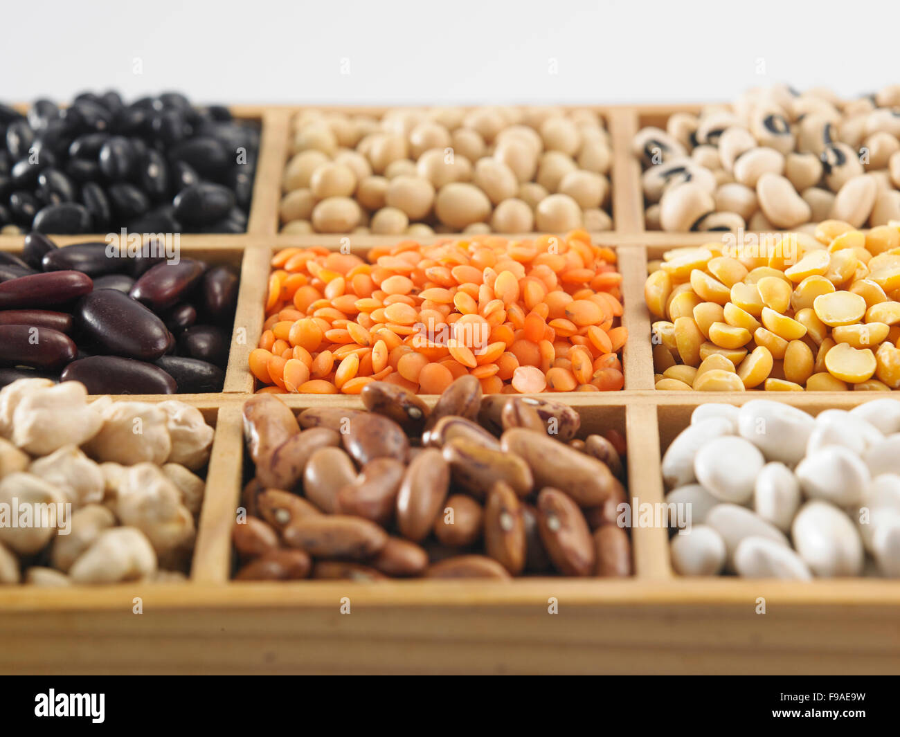 assorted beans in a wooden container Stock Photo - Alamy