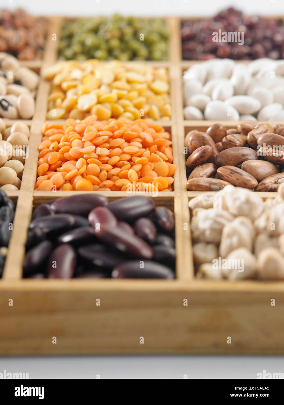 assorted beans in a wooden container Stock Photo - Alamy