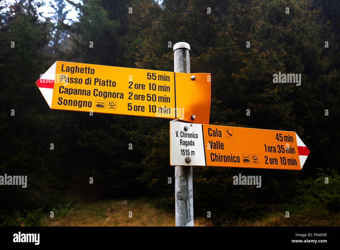 Sign indicating directions and walking times, Ticino, Swtizerland Stock ...