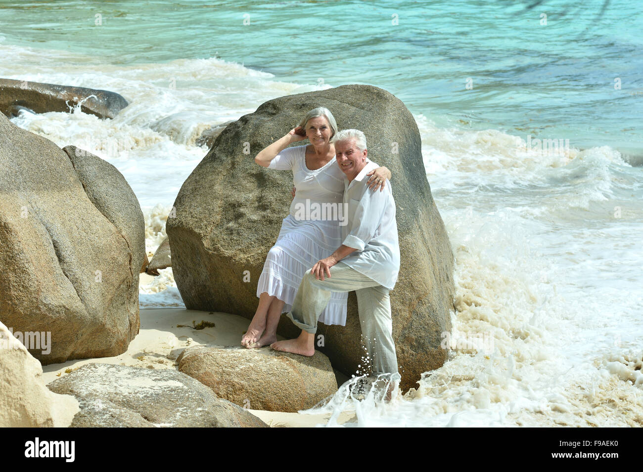 Elderly couple rest at tropical resort Stock Photo - Alamy