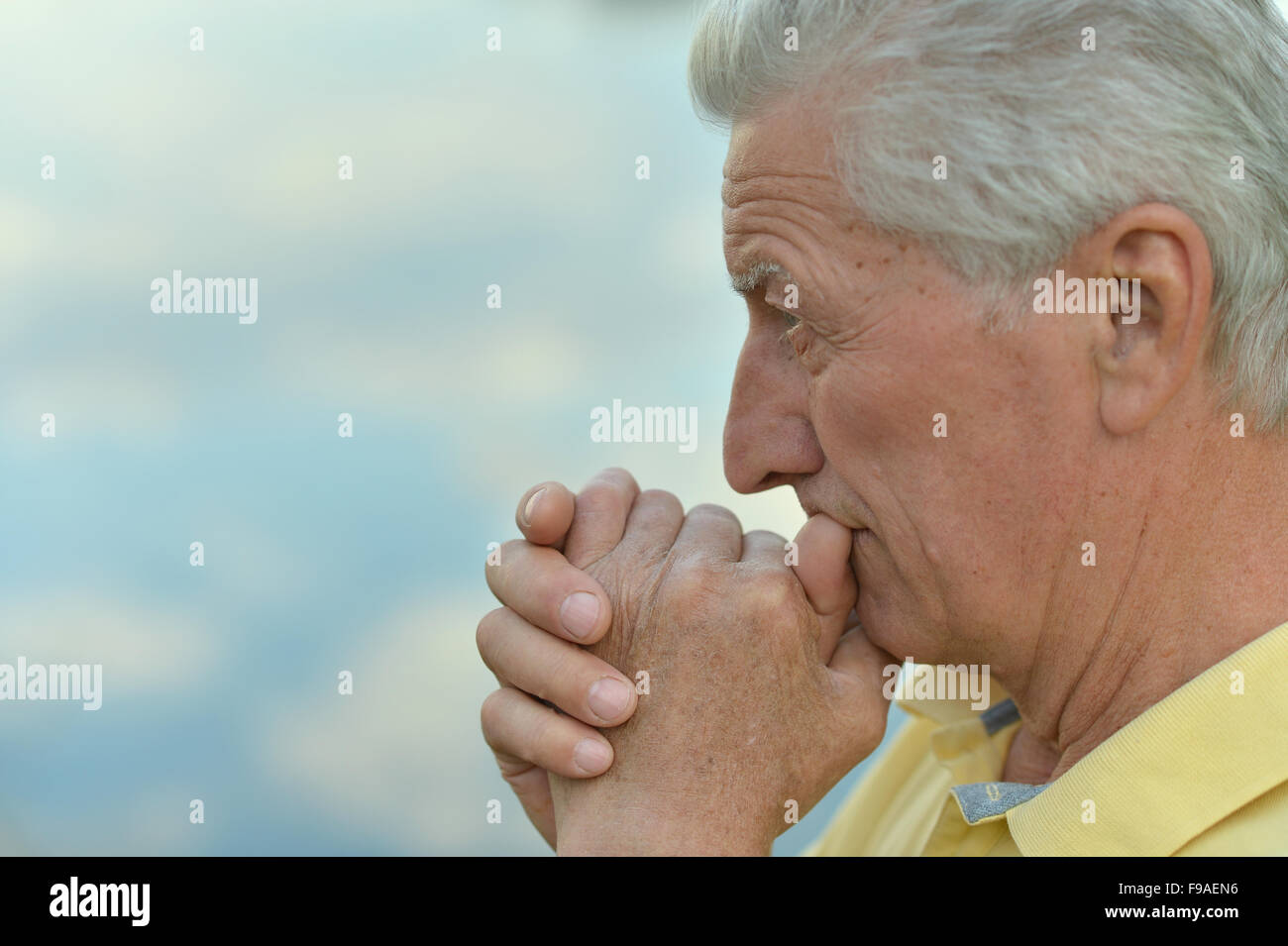 Senior man thinking Stock Photo - Alamy