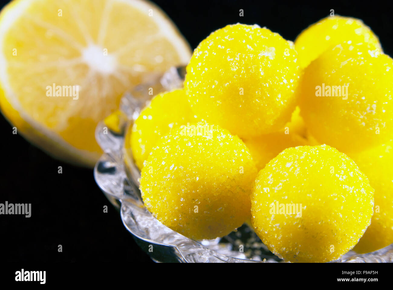 Lemon drop candy hi-res stock photography and images - Alamy