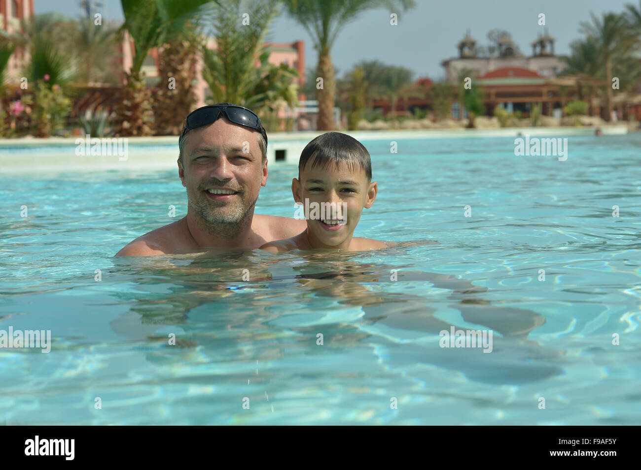 Father and son at swimming pool hi-res stock photography and images - Alamy