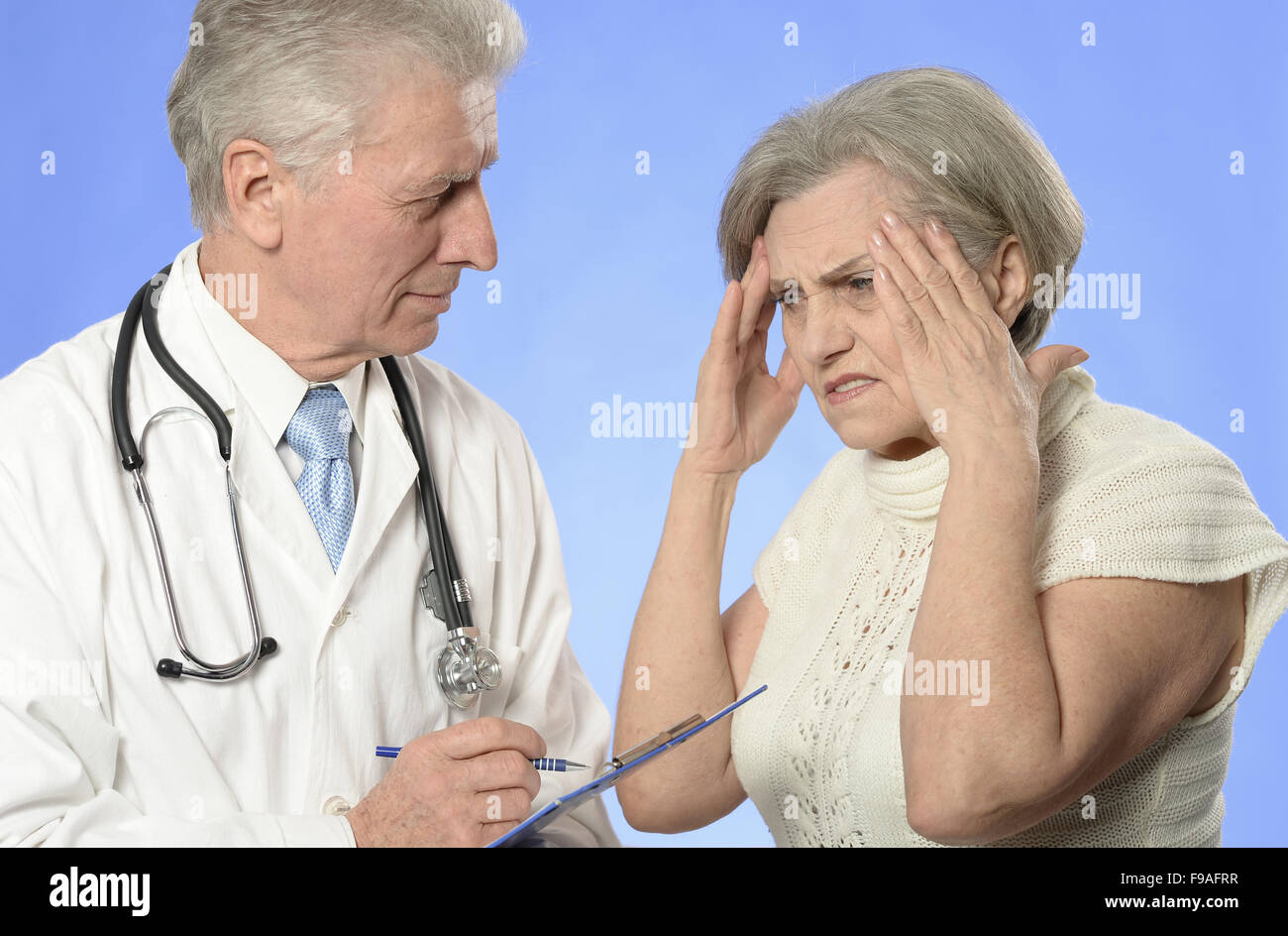 Senior woman visiting doctor Stock Photo - Alamy