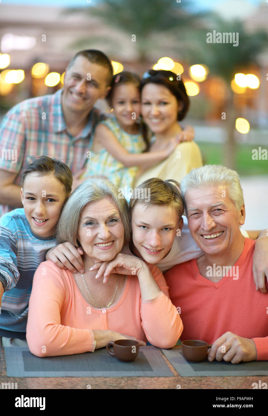 Family relaxing at resort Stock Photo - Alamy