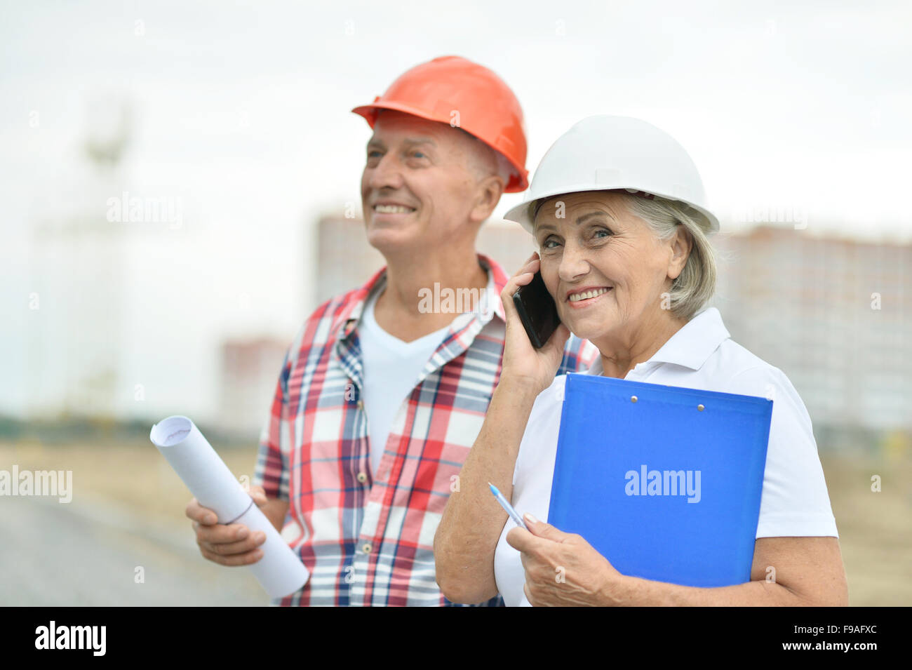 Senior couple in under construction Stock Photo - Alamy