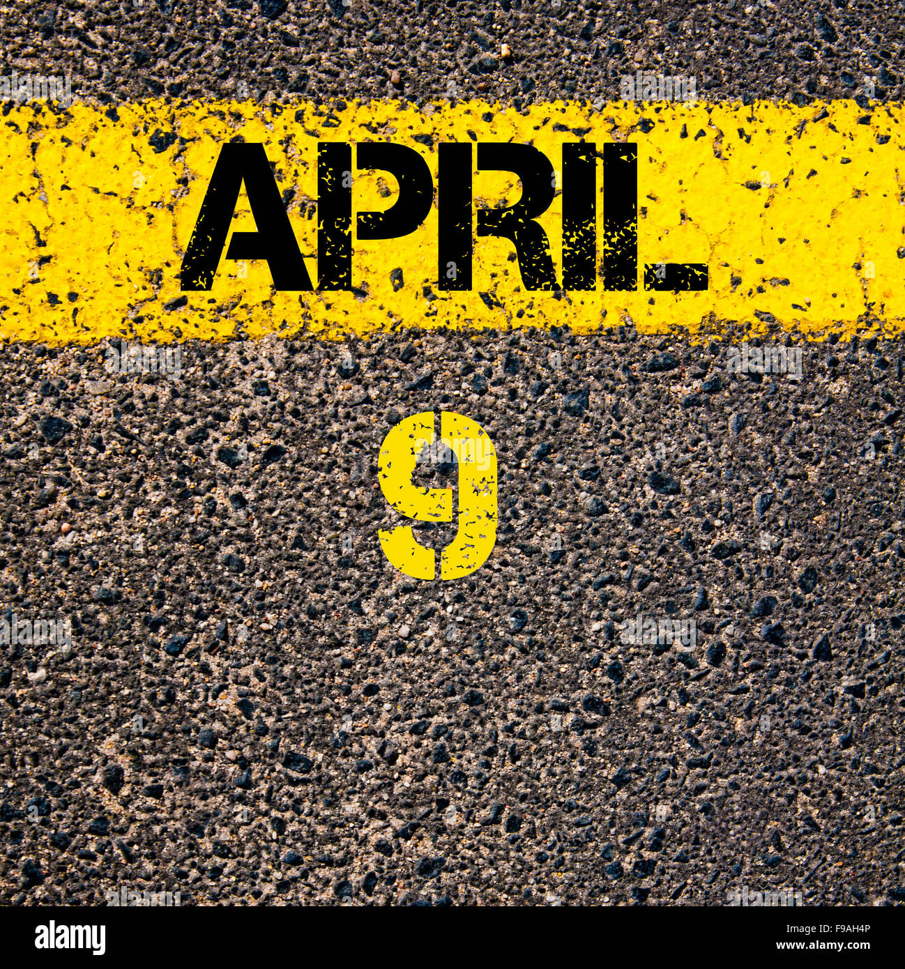 9 April calendar day written over road marking yellow paint line Stock ...