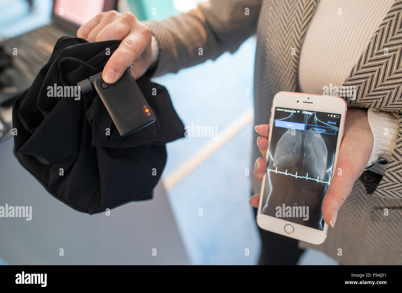Nancy Greco, employee of IBM's research division, shows a smartphone ...