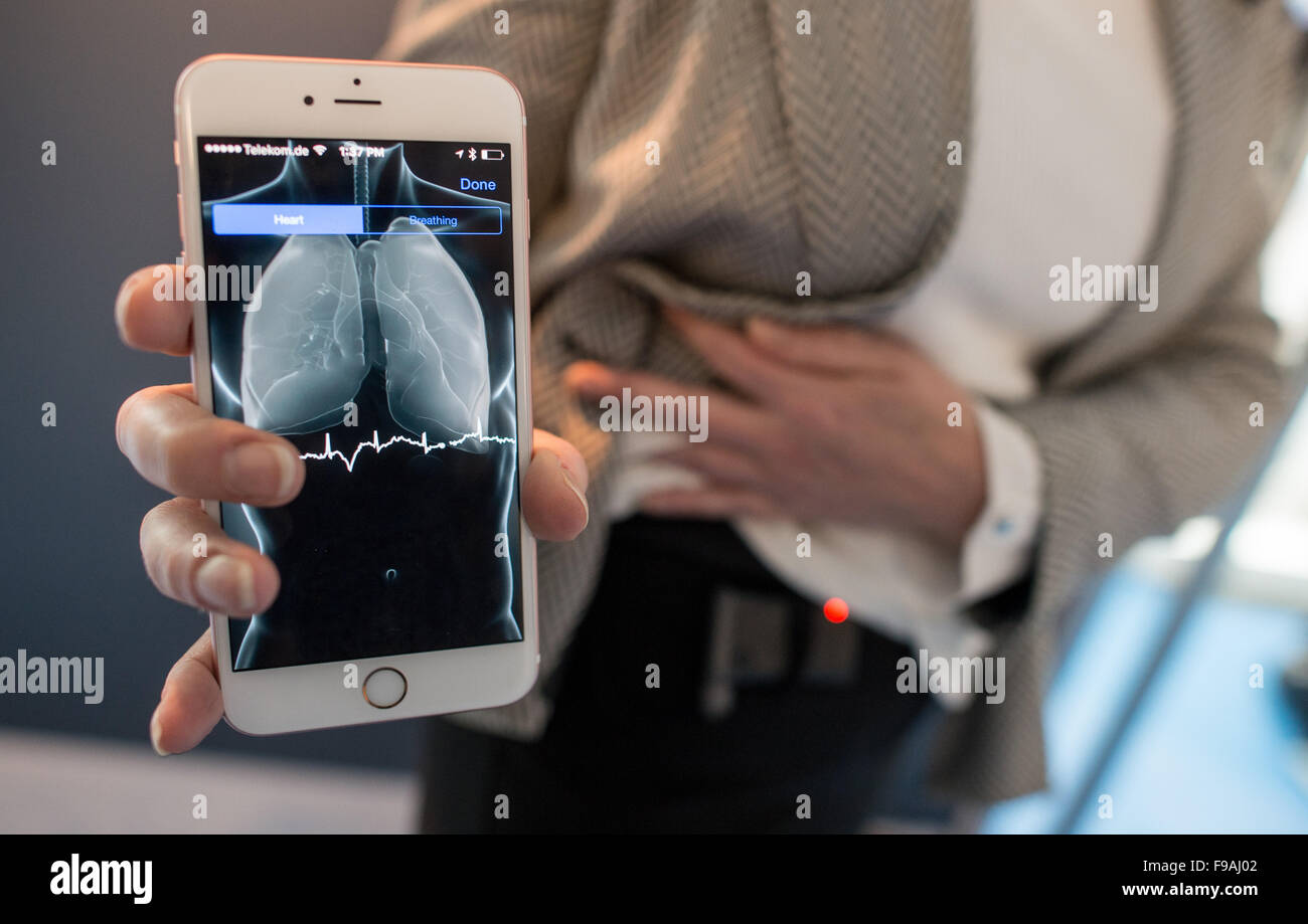 Nancy Greco, employee of IBM's research division, shows a smartphone ...