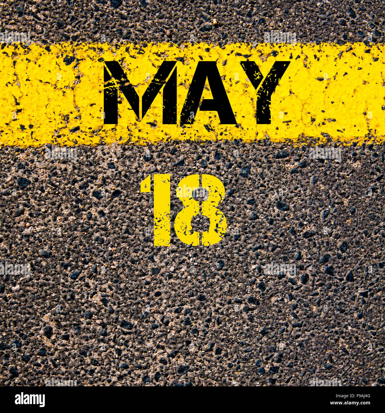 18 May calendar day written over road marking yellow paint line Stock ...