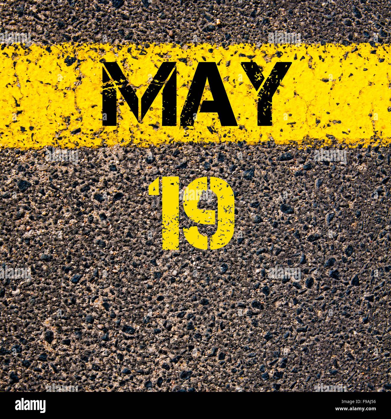 19 May calendar day written over road marking yellow paint line Stock ...