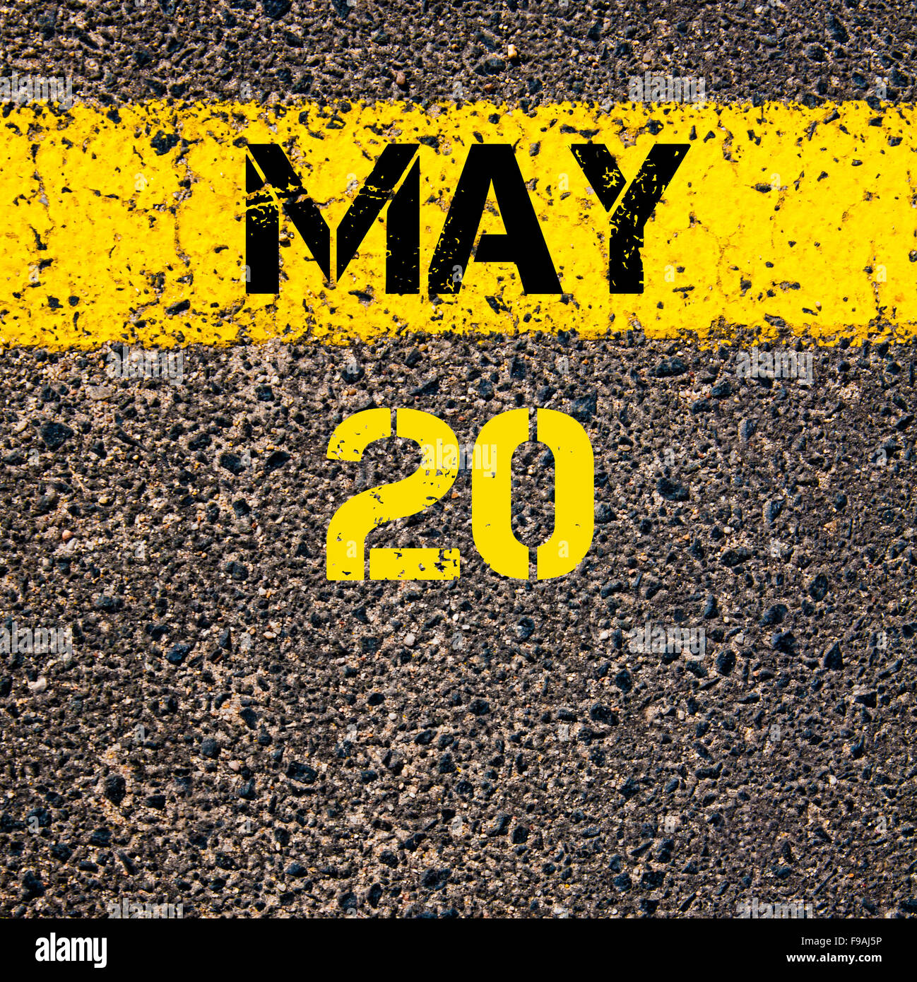 20 May calendar day written over road marking yellow paint line Stock ...