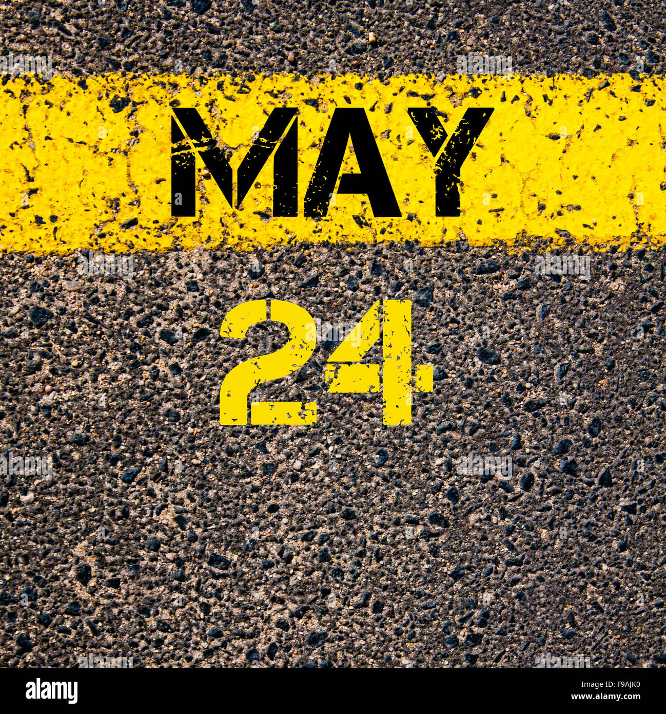 24 May calendar day written over road marking yellow paint line Stock ...