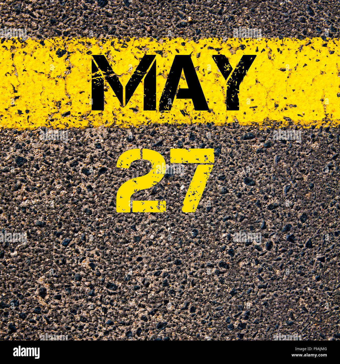 27 May calendar day written over road marking yellow paint line Stock ...