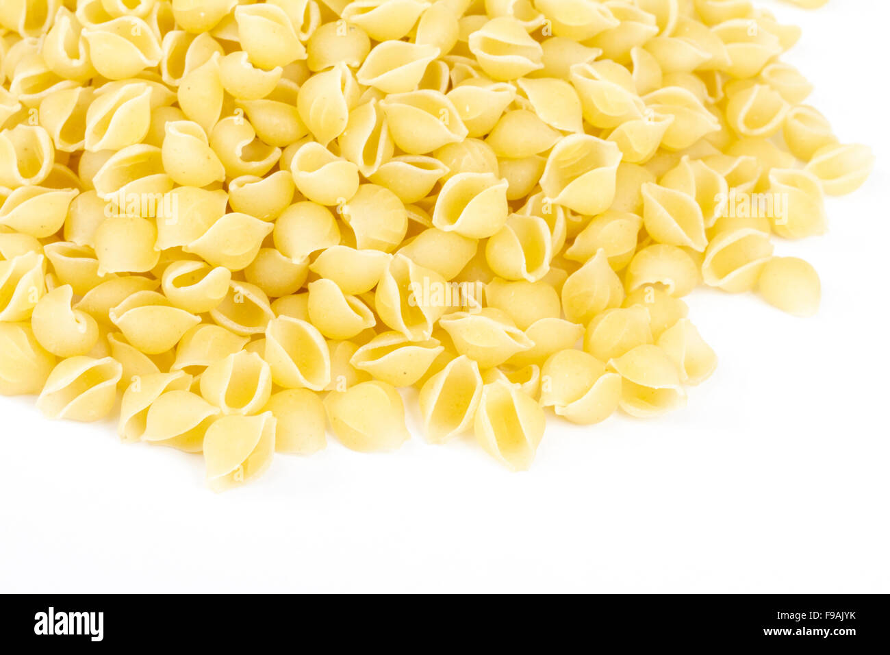 Heap of raw pasta (conchiglie Stock Photo - Alamy