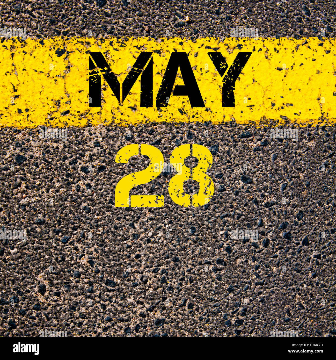 28 May calendar day written over road marking yellow paint line Stock ...