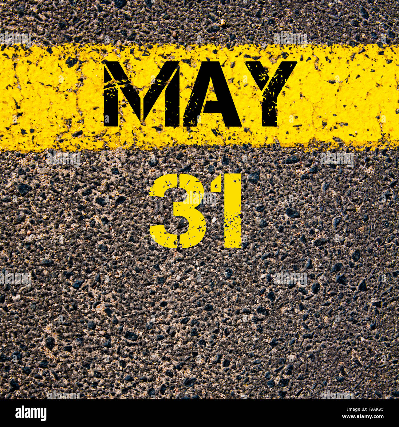 31 May calendar day written over road marking yellow paint line Stock ...