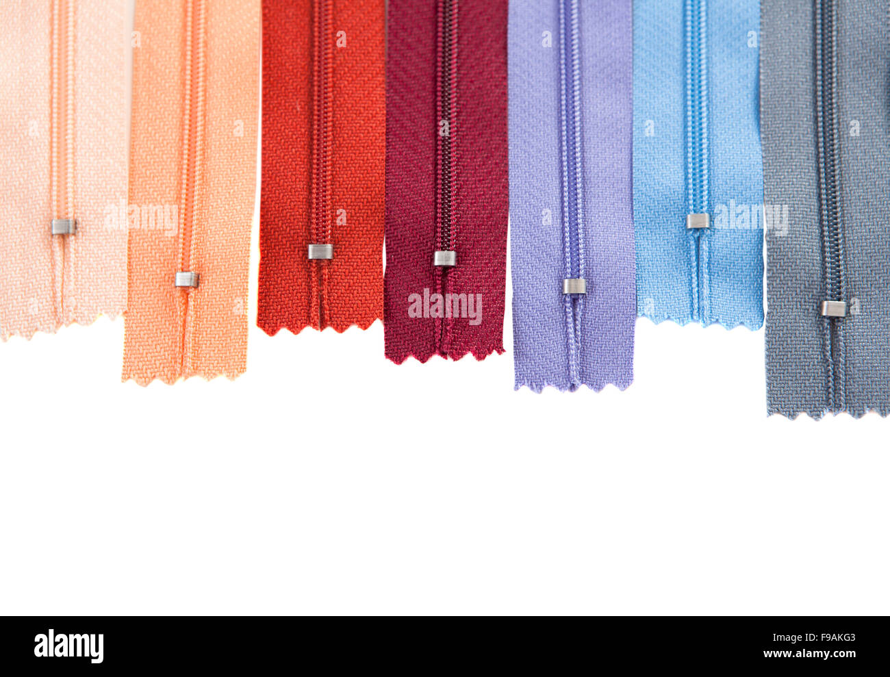 different colorful zippers in front of white background, isolated Stock ...