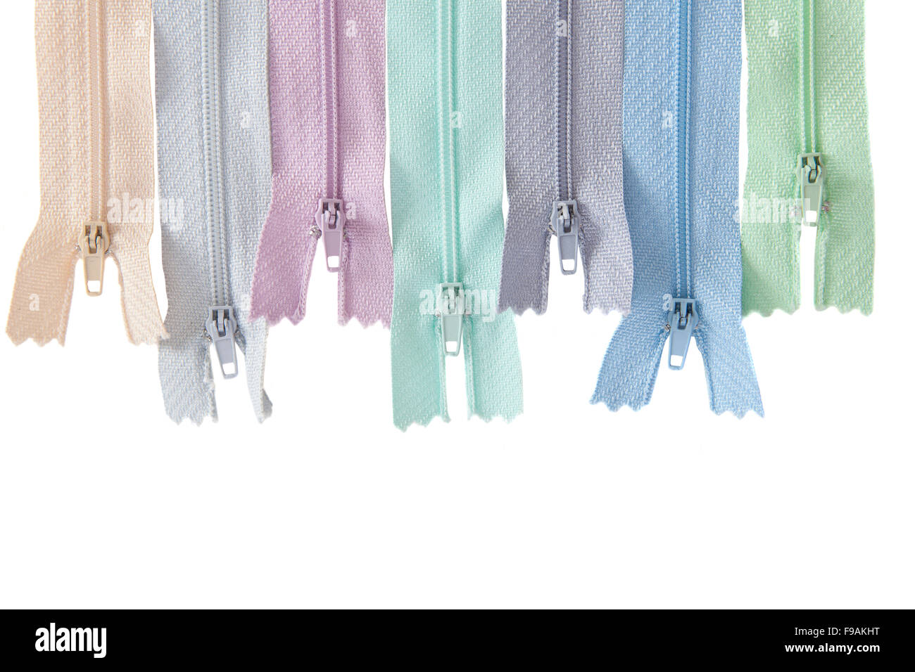 different colorful zippers in front of white background, isolated Stock ...