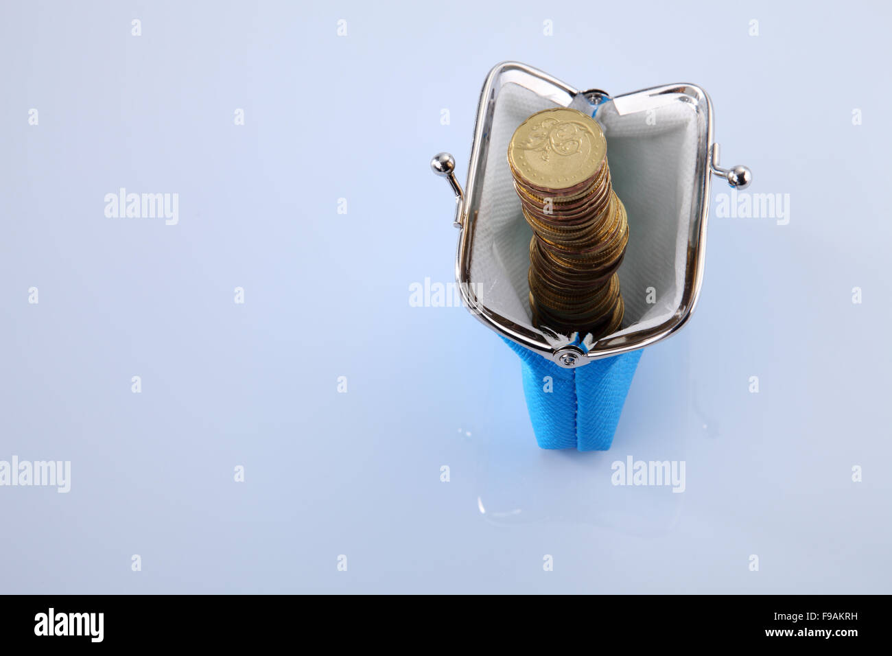 coins in the blue color purse Stock Photo - Alamy