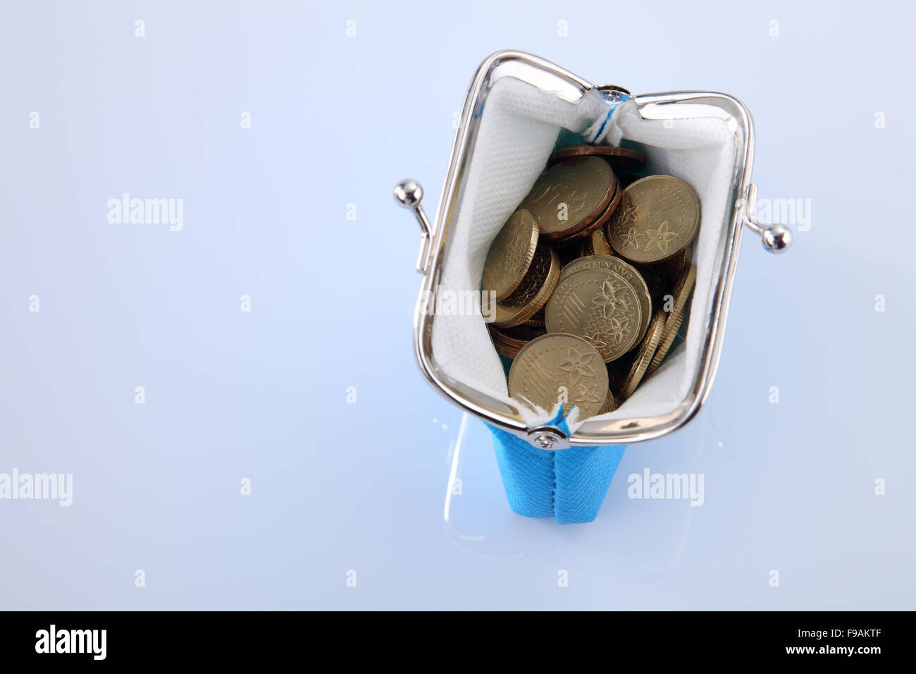 coins in the blue color purse Stock Photo - Alamy