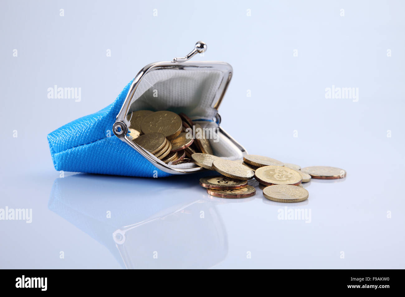 coins in the blue color purse Stock Photo - Alamy