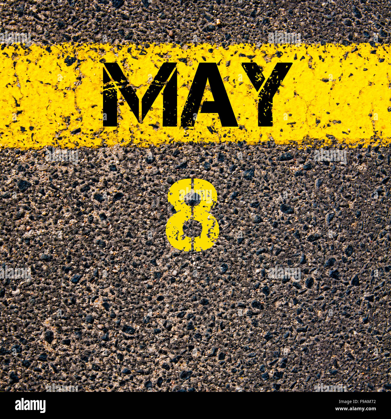 8 May calendar day written over road marking yellow paint line Stock ...