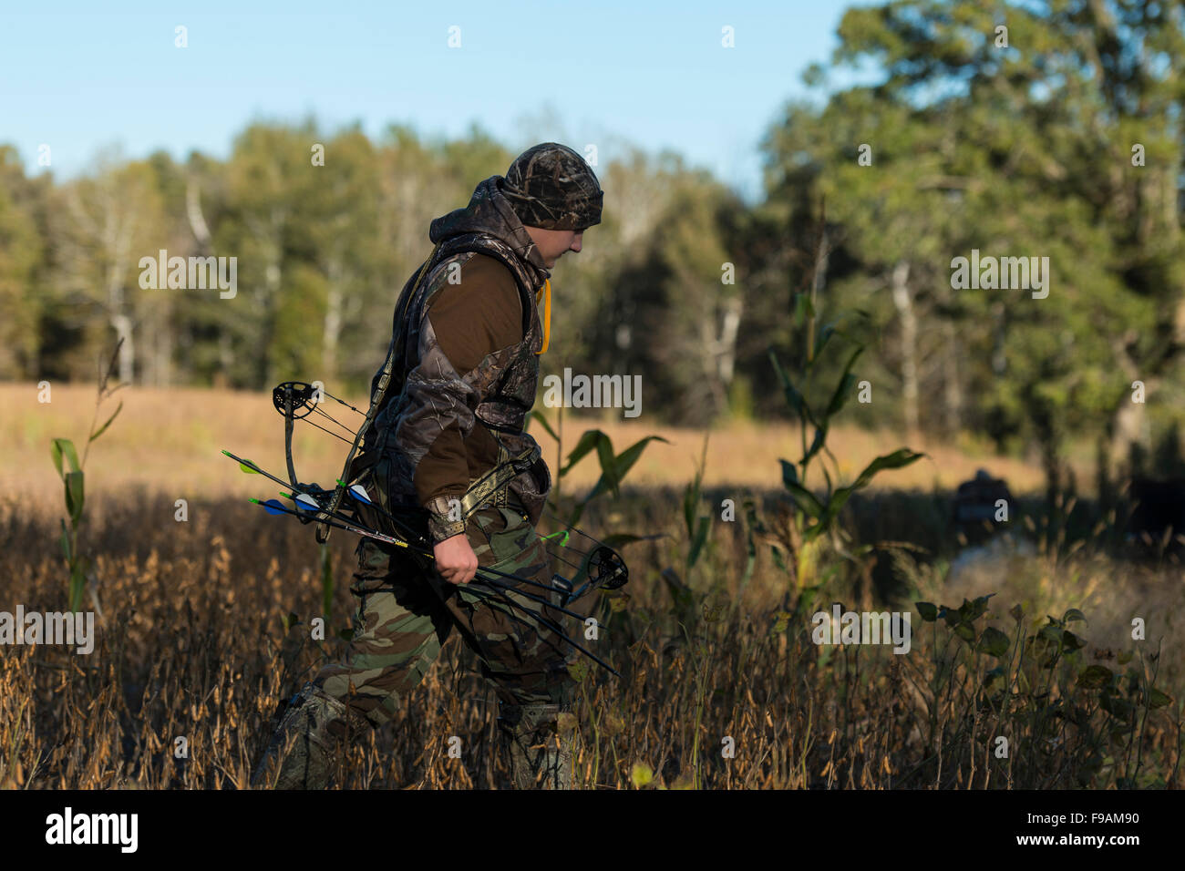 A young Bowhunter going out hunting Stock Photo - Alamy
