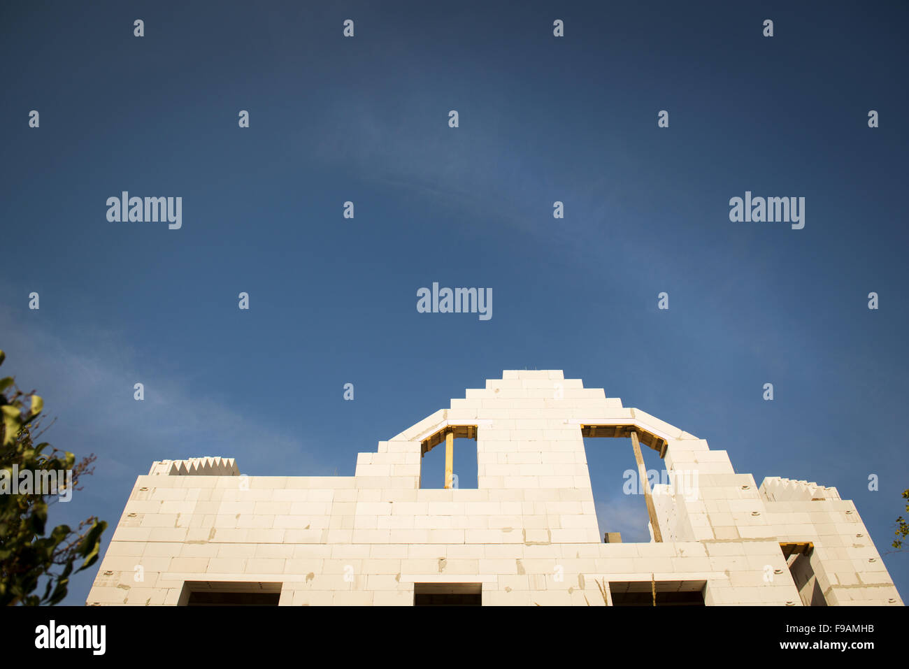 Construction Contractors building a big new home Stock Photo - Alamy