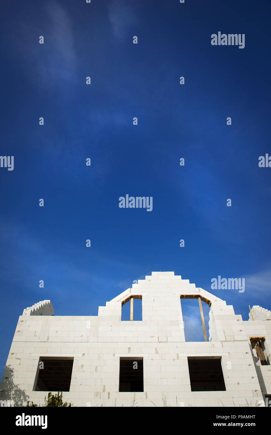 Construction Contractors building a big new home Stock Photo - Alamy