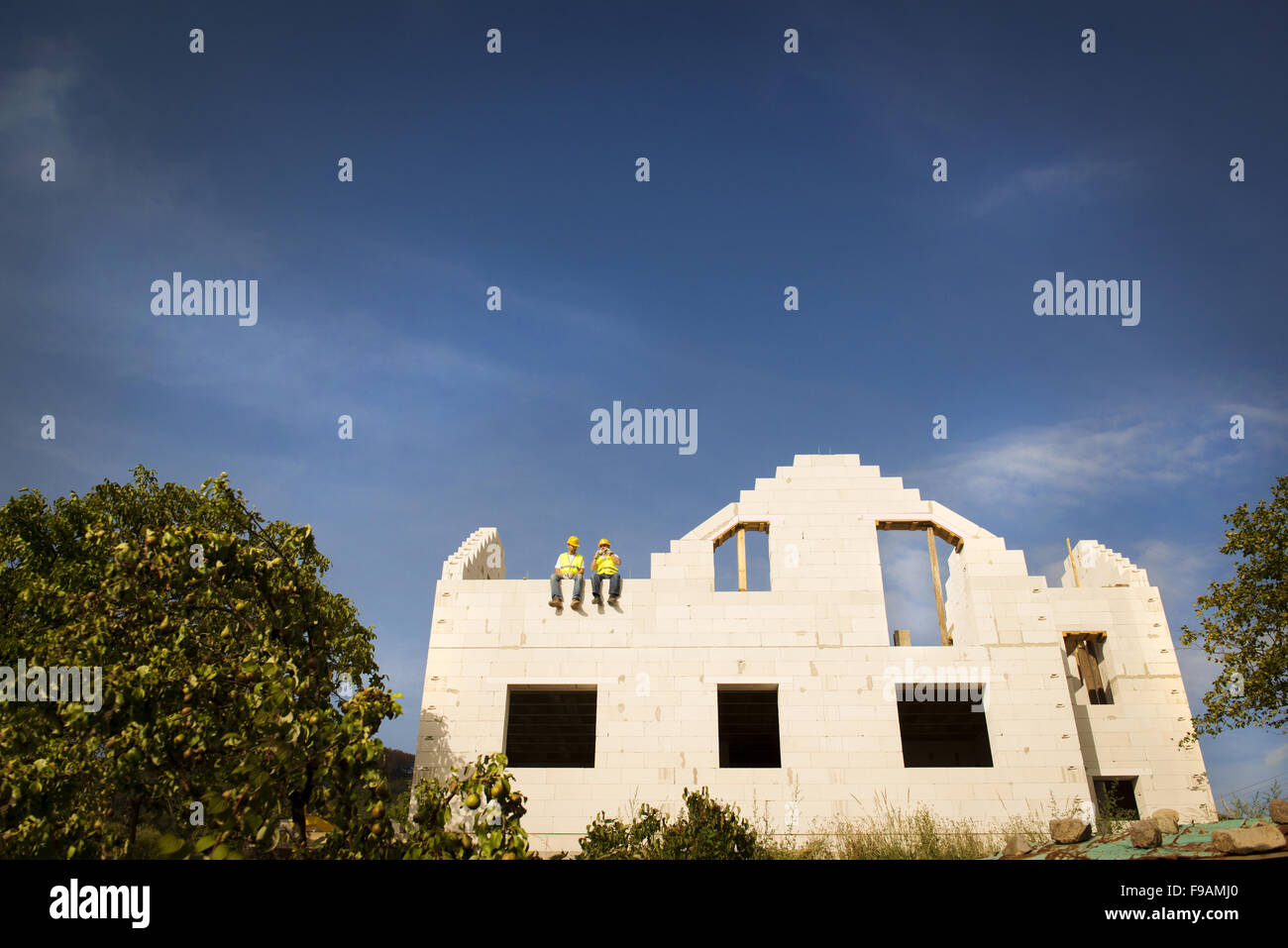 Construction contractors building big hi-res stock photography and ...