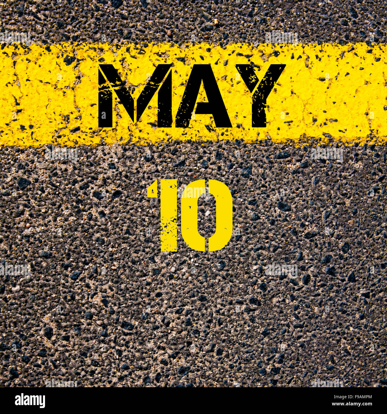 10 May calendar day written over road marking yellow paint line Stock ...