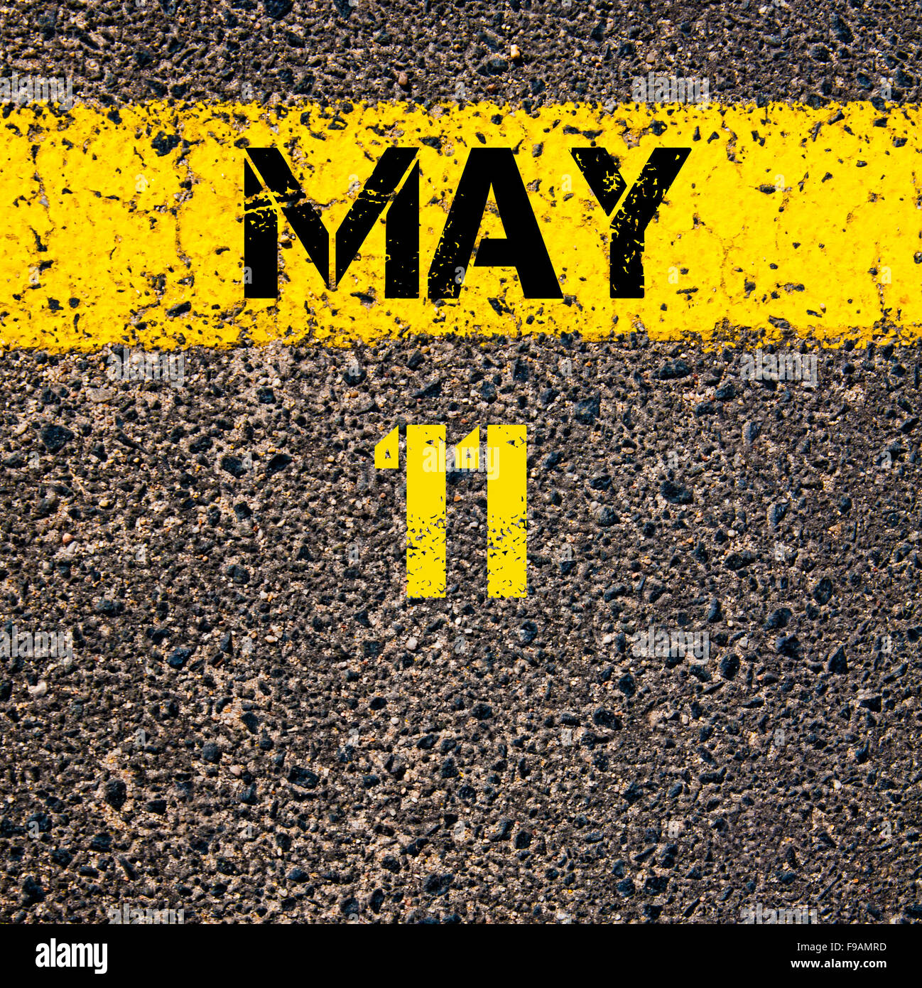 11 May calendar day written over road marking yellow paint line Stock ...