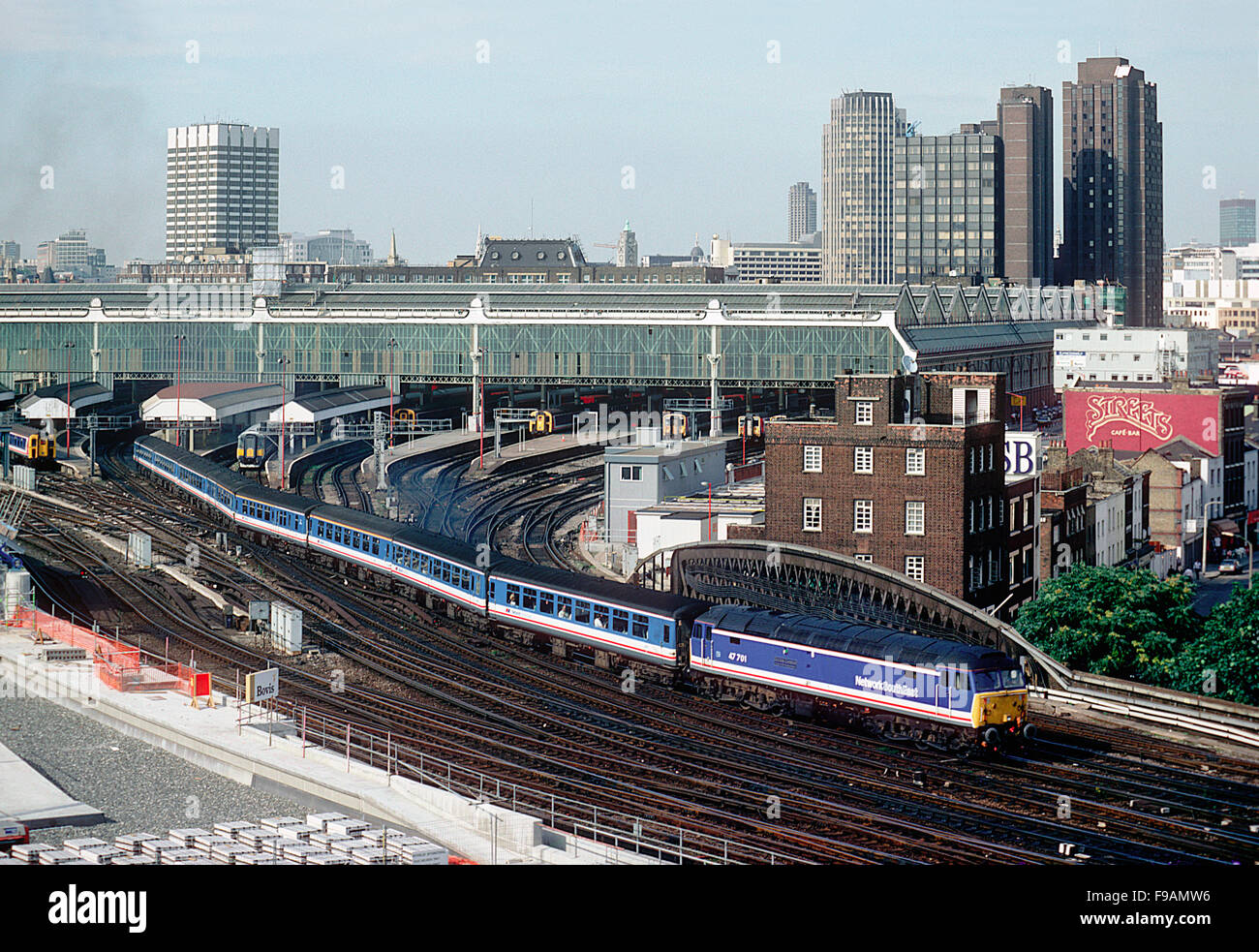 A class 47 locomotive number 47701 departs London Waterloo with a ...