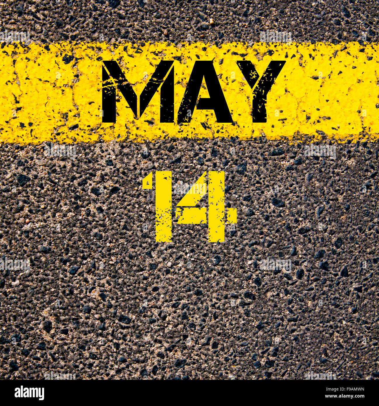 14 May calendar day written over road marking yellow paint line Stock ...
