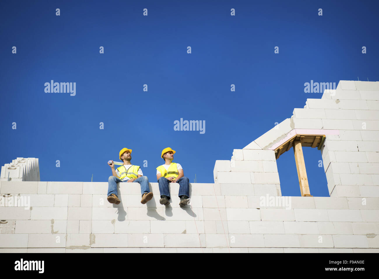 Construction contractors building big hi-res stock photography and ...